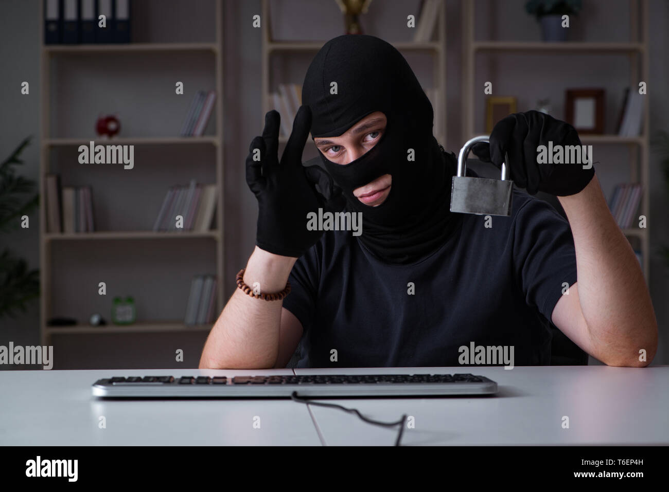 Hacker hacking computer late at night Stock Photo - Alamy