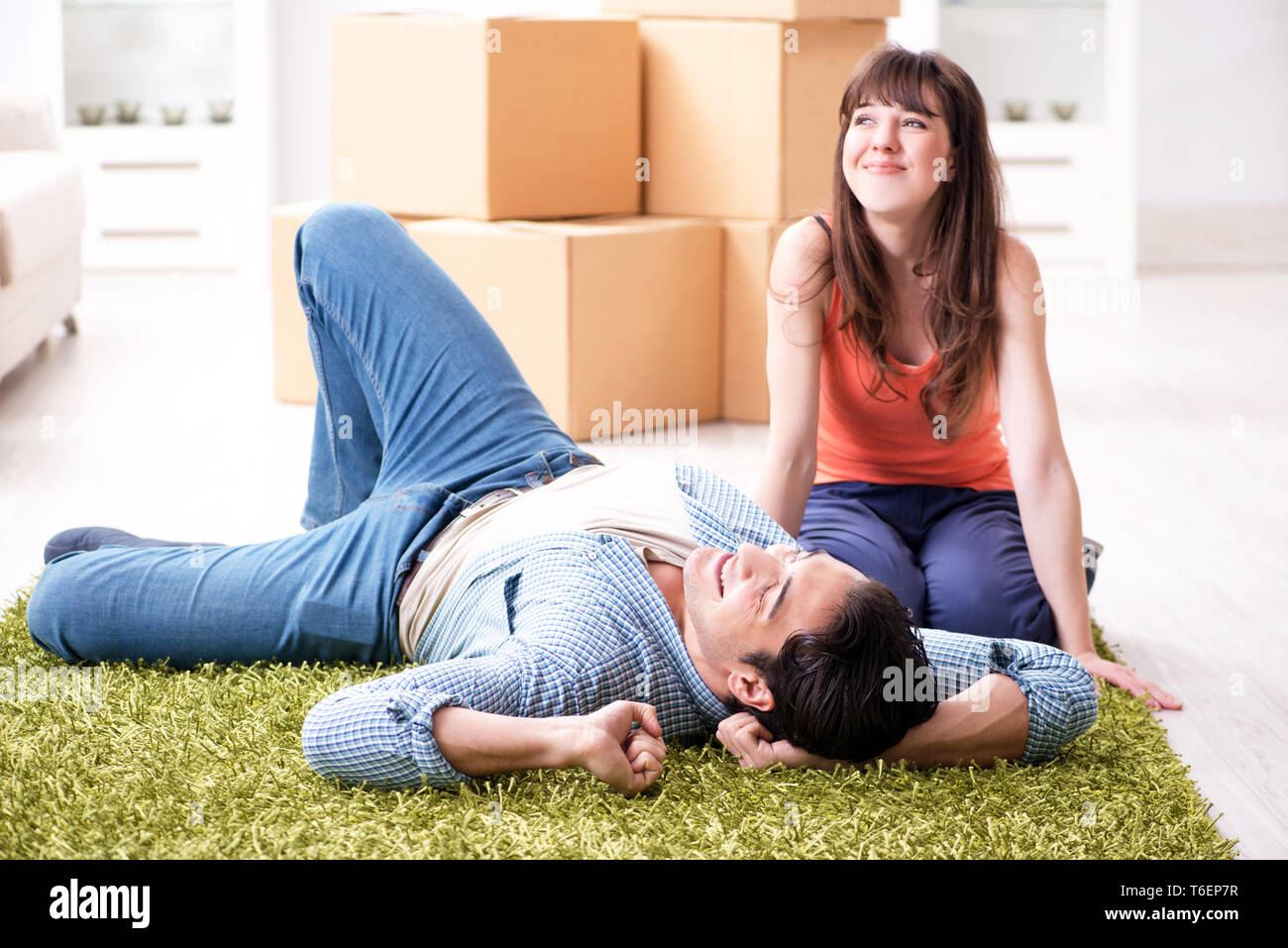 Tired family relaxing moving house hi-res stock photography and images ...
