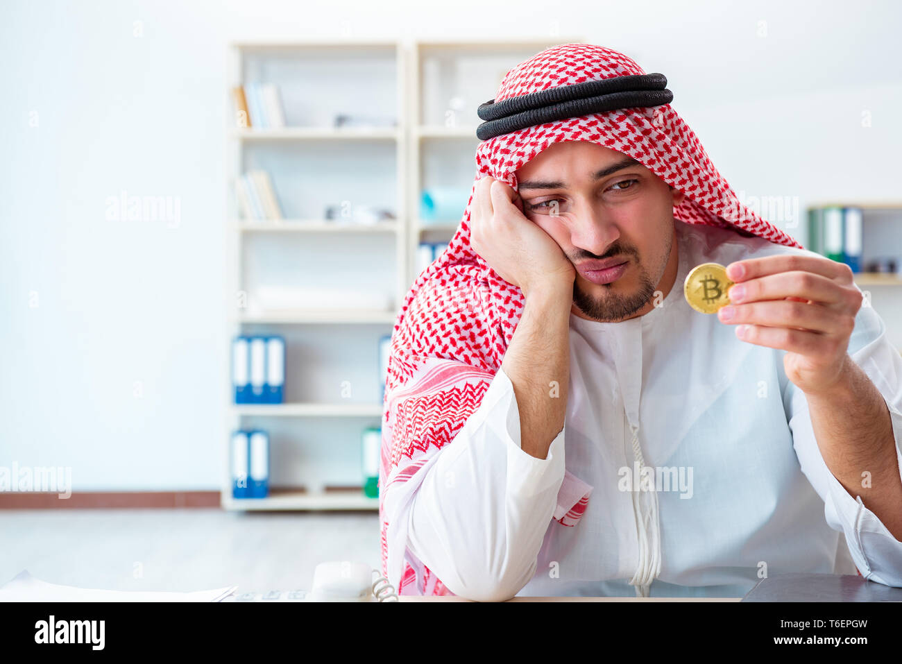Arab man with bitcoin in cryptocurrency mining concept Stock Photo - Alamy