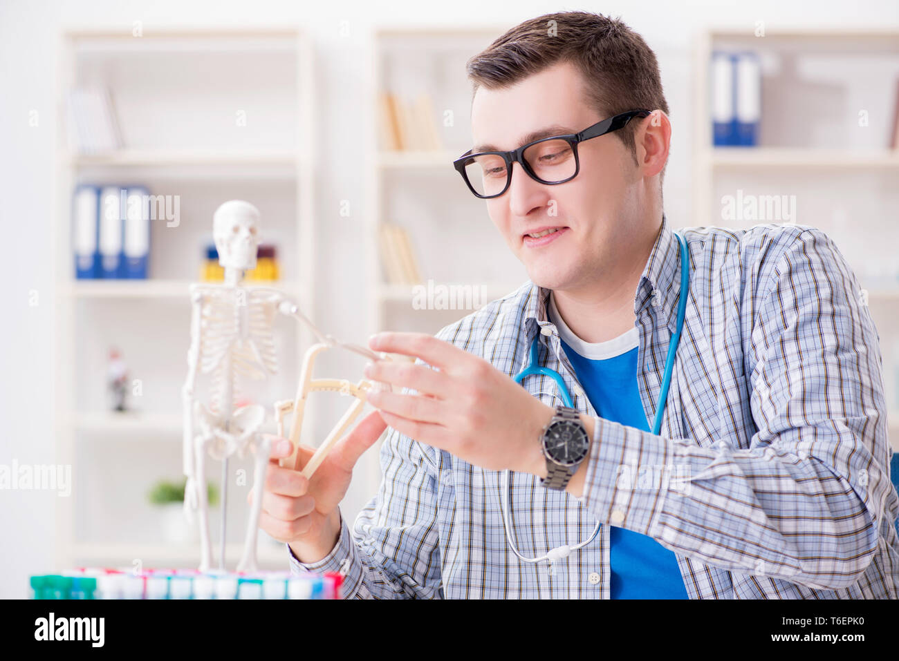 Medical student studying skeleton in classroom during lecture Stock ...
