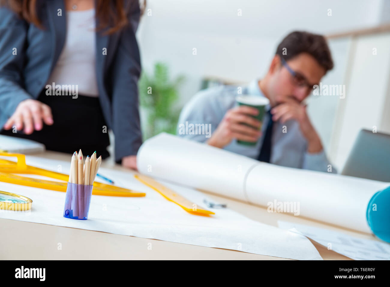 Engineers studying blueprint table hi-res stock photography and images ...