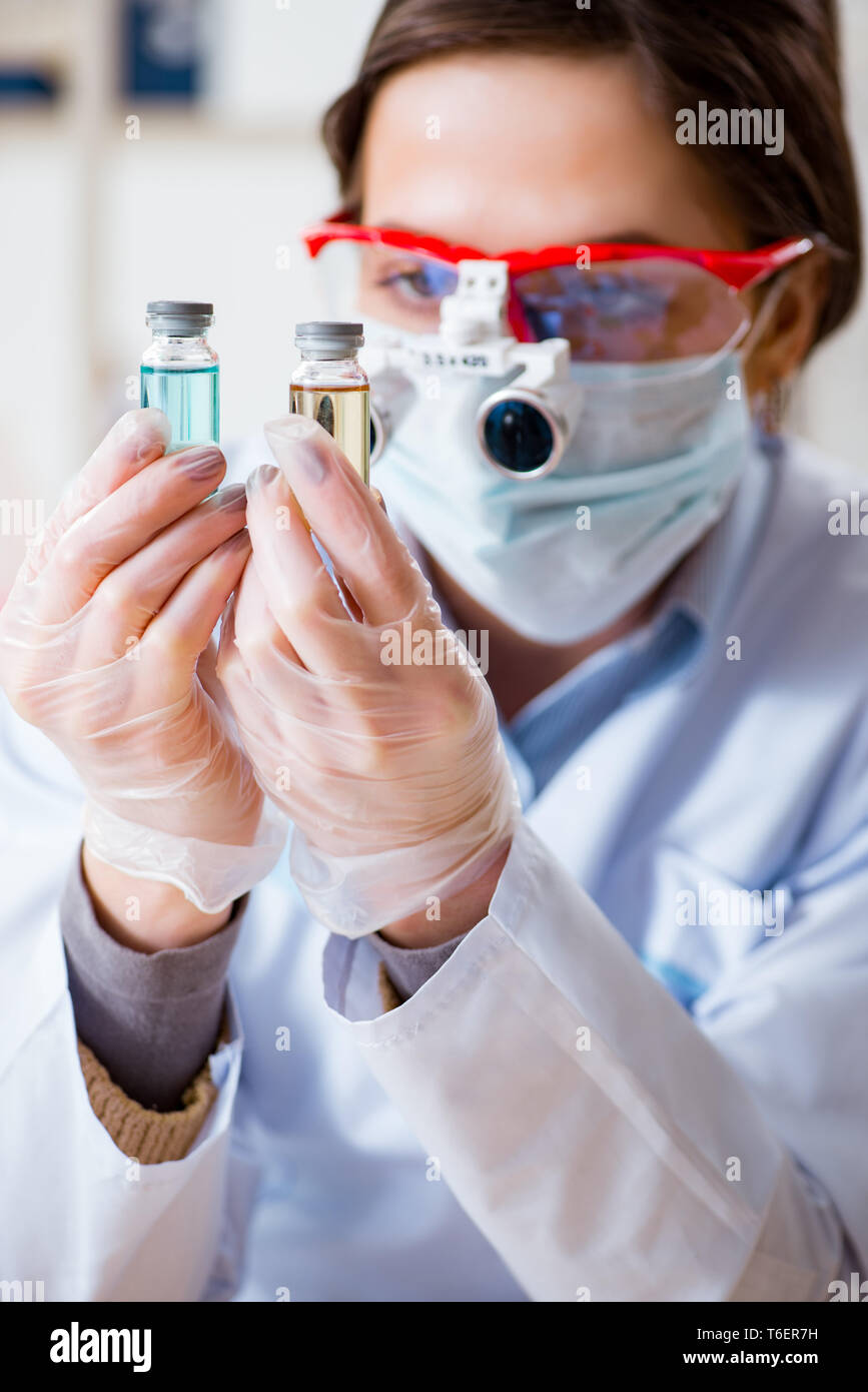 Lab assistant in drug synthesis concept Stock Photo - Alamy
