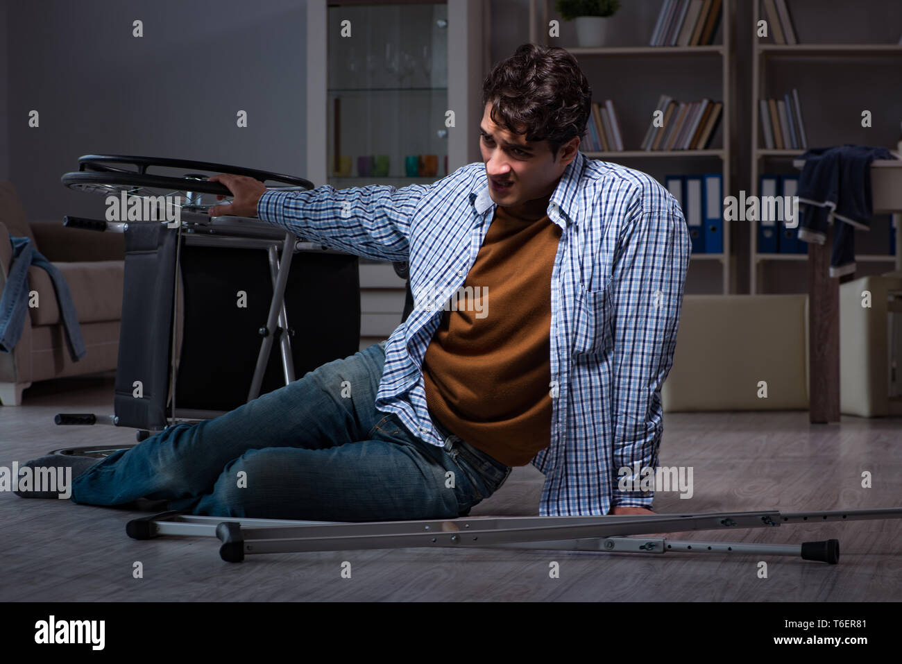 Man falling off chair hi-res stock photography and images - Alamy