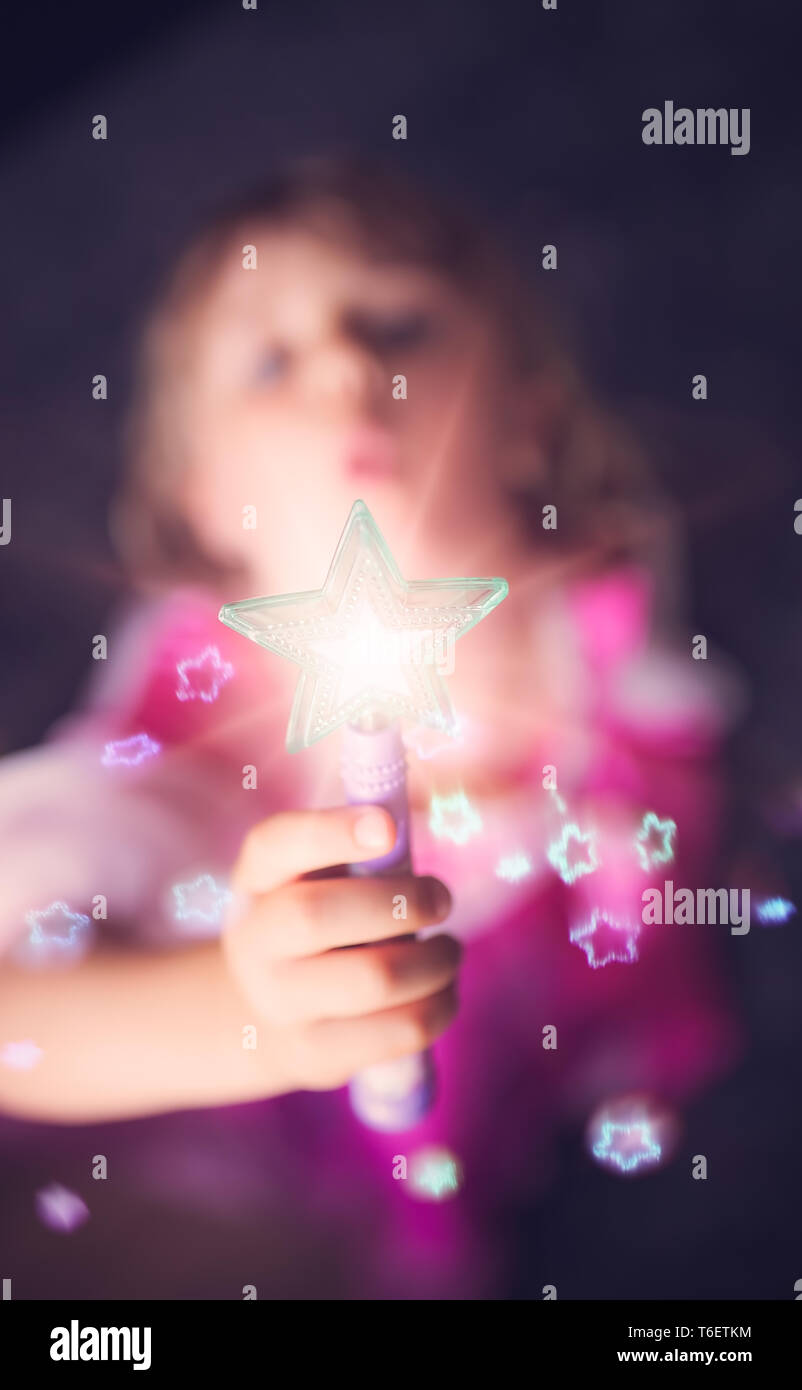 Cute fairy girl casting magic spells Stock Photo - Alamy