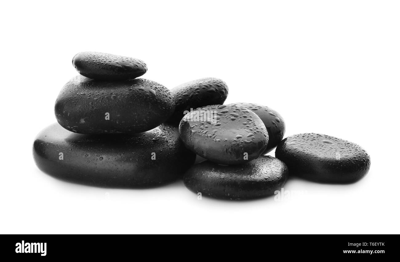 Pile of spa stones on white background Stock Photo - Alamy