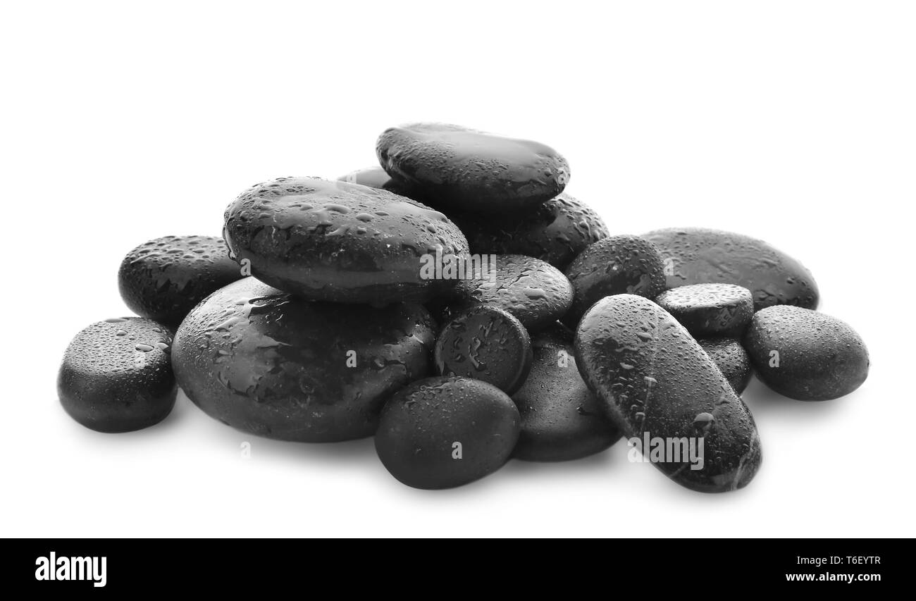 Pile of spa stones on white background Stock Photo - Alamy