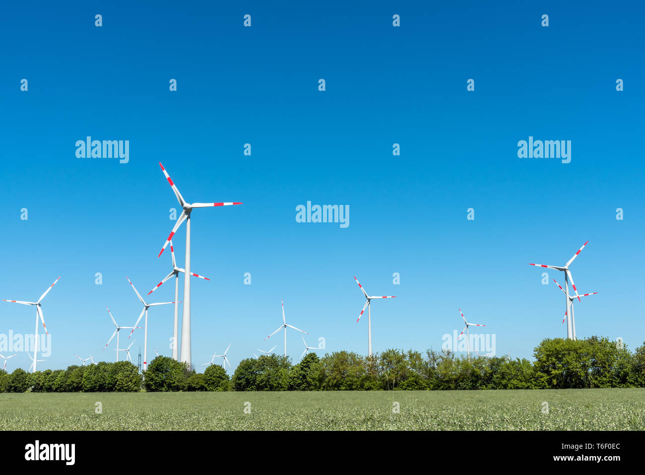Wind generators under a blue sky seen in Germany Stock Photo - Alamy