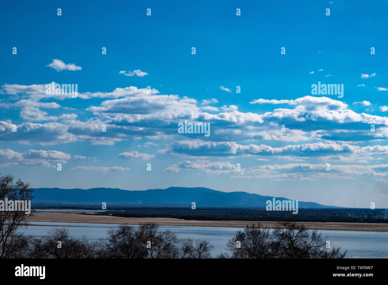 The spring Park is illuminated by the bright sun. View of a large and ...