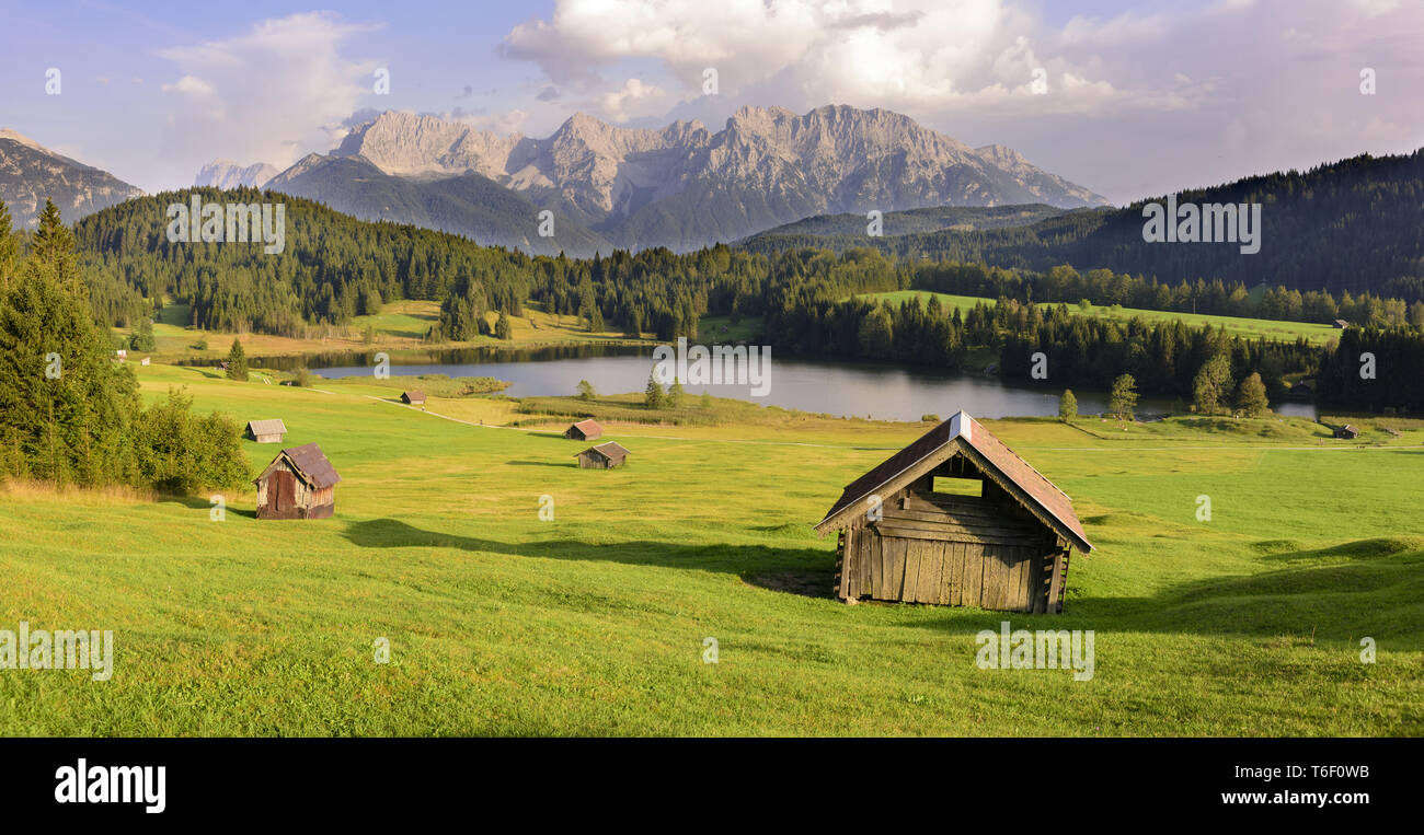Panoramic landscape in Bavaria with alps mountain range and lake ...