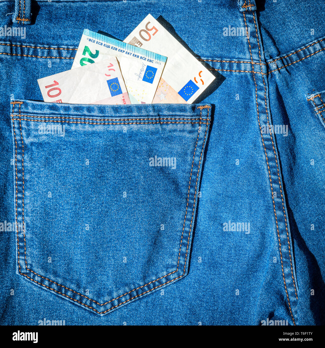 Money in blue jeans pocket Stock Photo - Alamy
