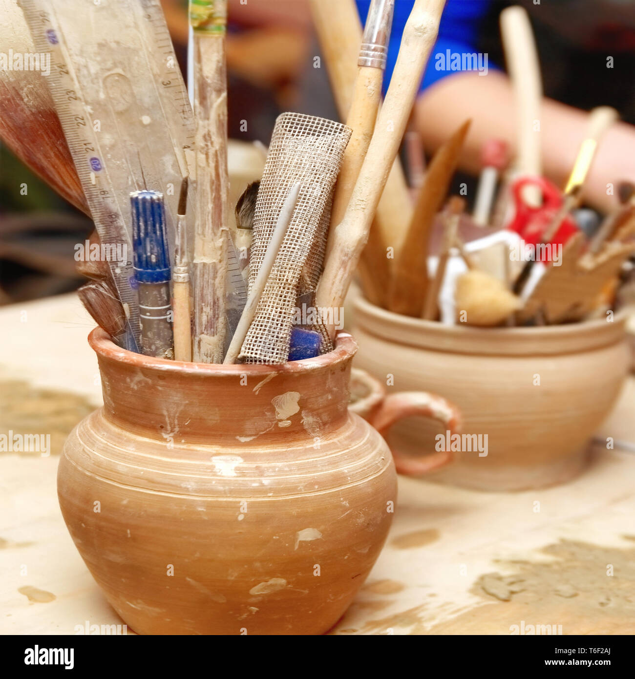 Handmade old clay pots with pencils Stock Photo - Alamy