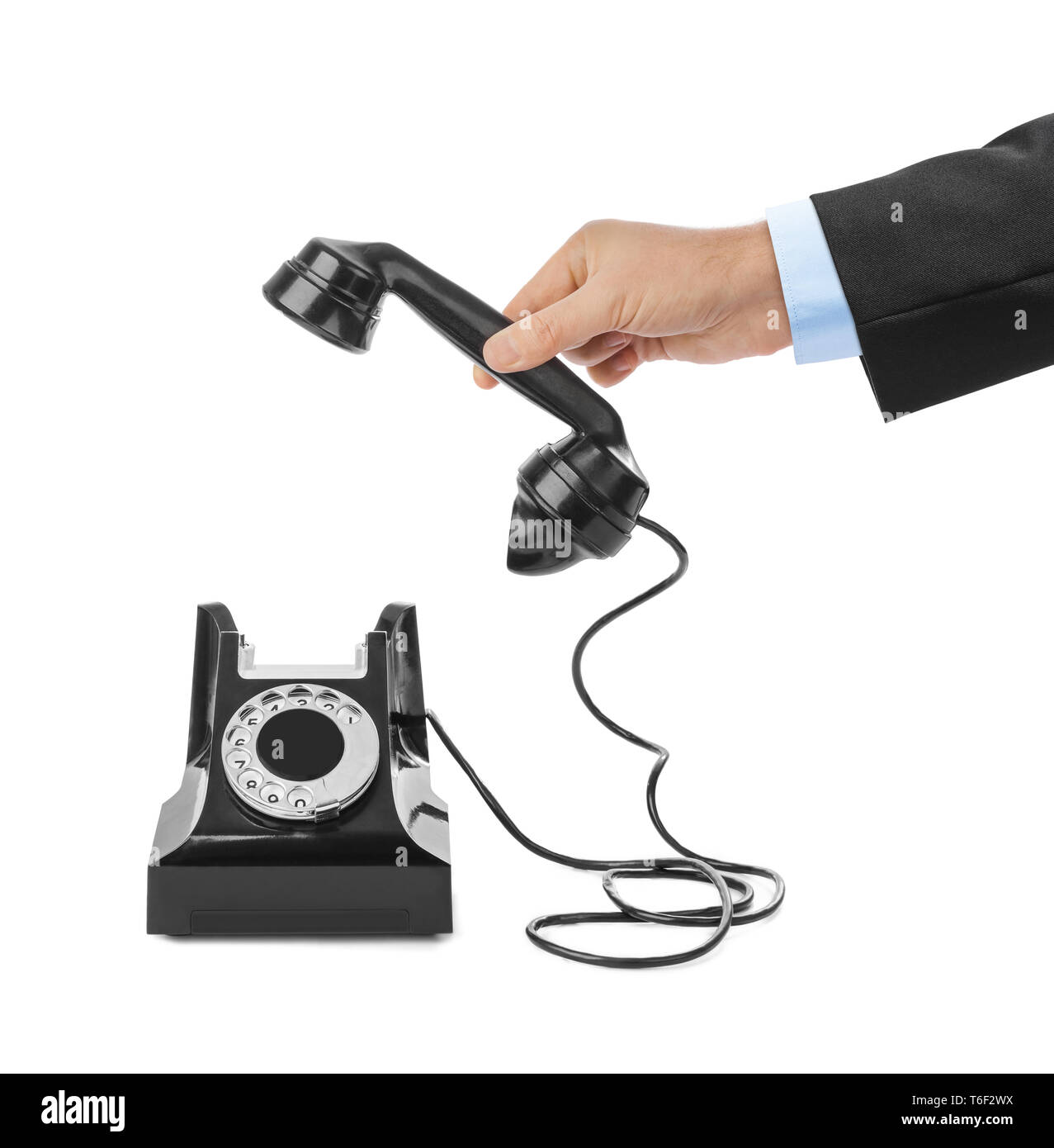 Hand and vintage telephone Stock Photo - Alamy