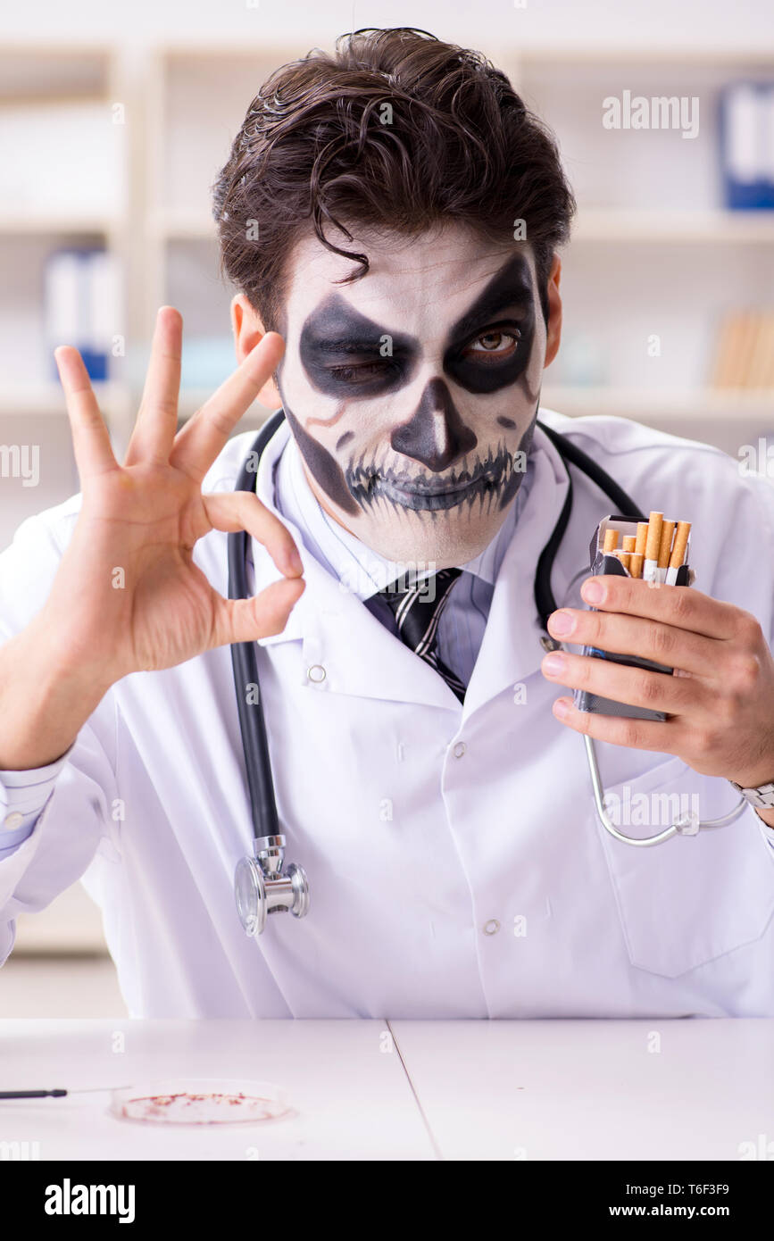 Scary monster doctor working in lab Stock Photo - Alamy
