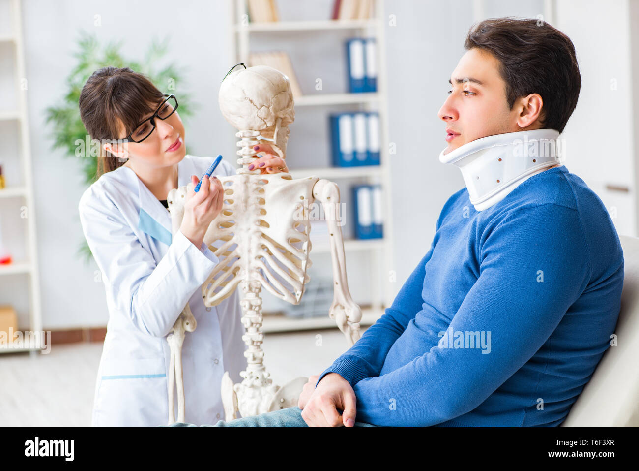 Doctor is explaining to patient with neck injury Stock Photo - Alamy