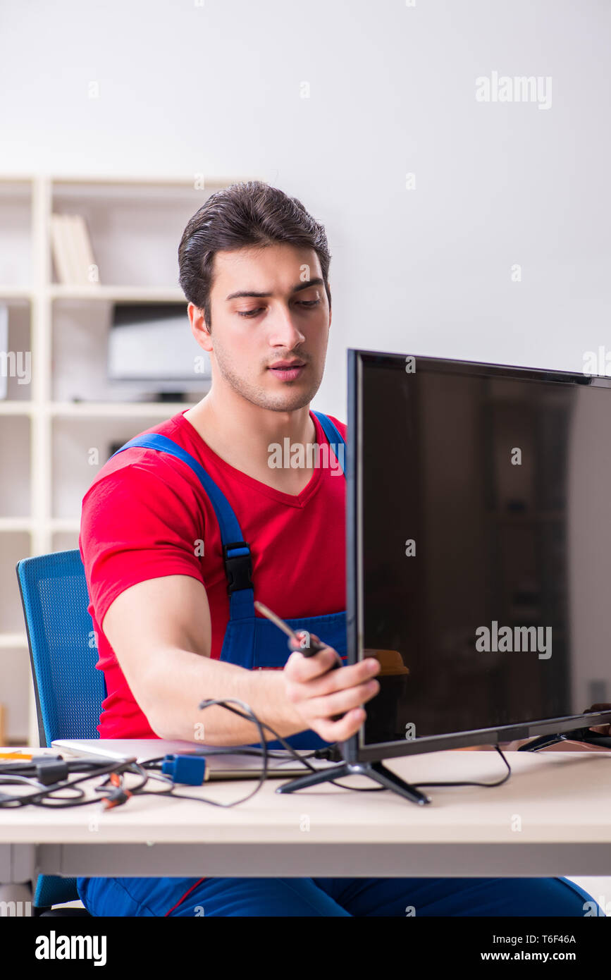 Professional repair engineer repairing broken tv Stock Photo - Alamy