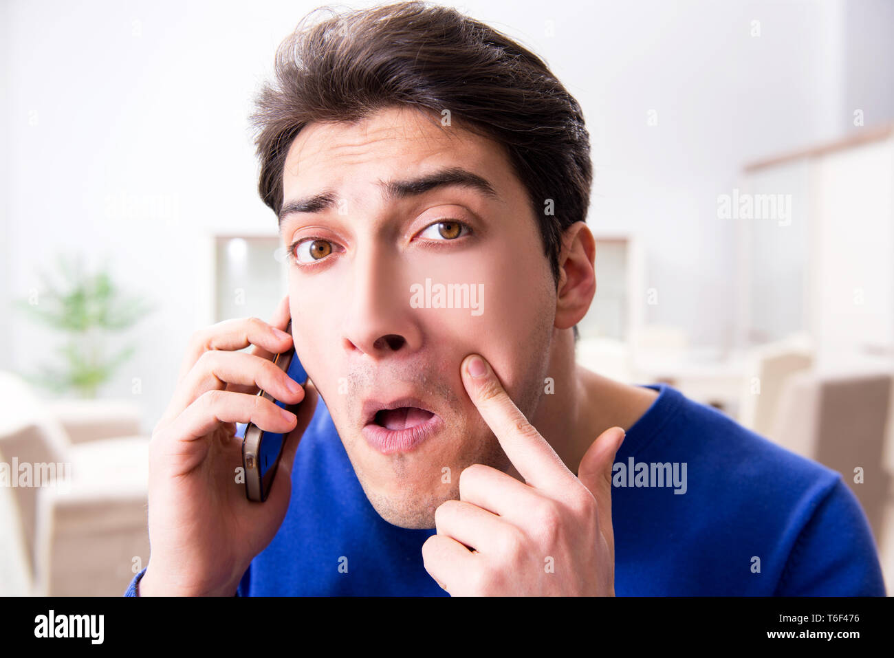 Man panicking because of pimples on the skin Stock Photo - Alamy
