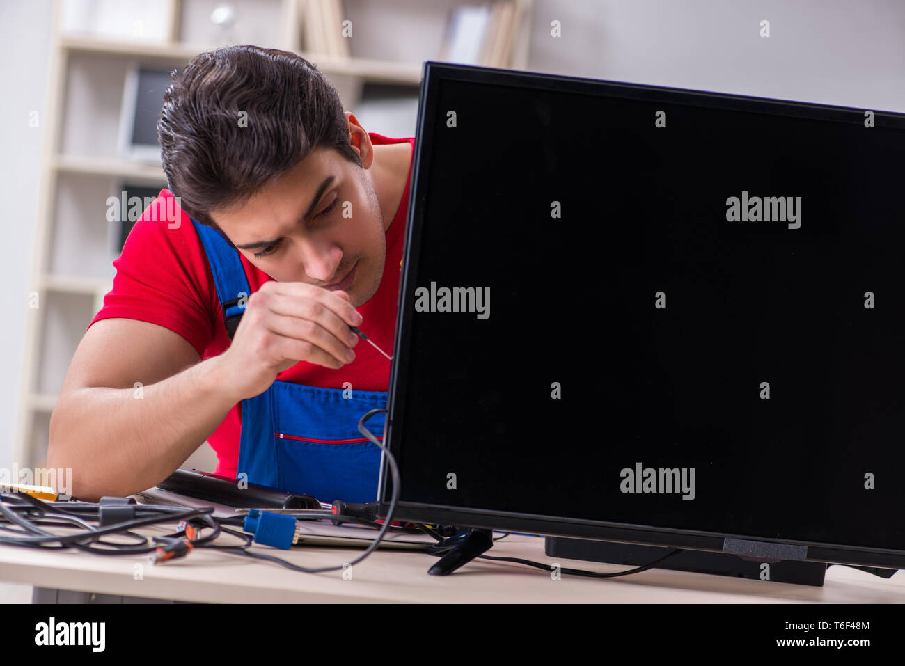 Professional repair engineer repairing broken tv Stock Photo - Alamy