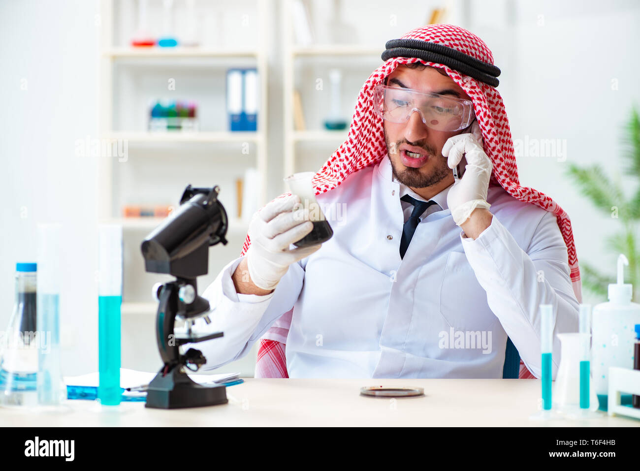 Arab chemist scientist testing quality of oil petrol Stock Photo - Alamy