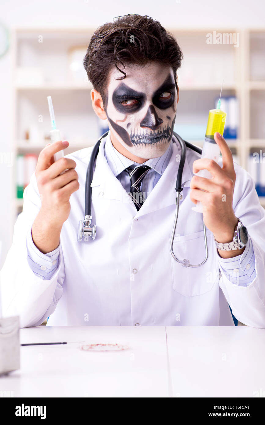 Scary monster doctor working in lab Stock Photo - Alamy