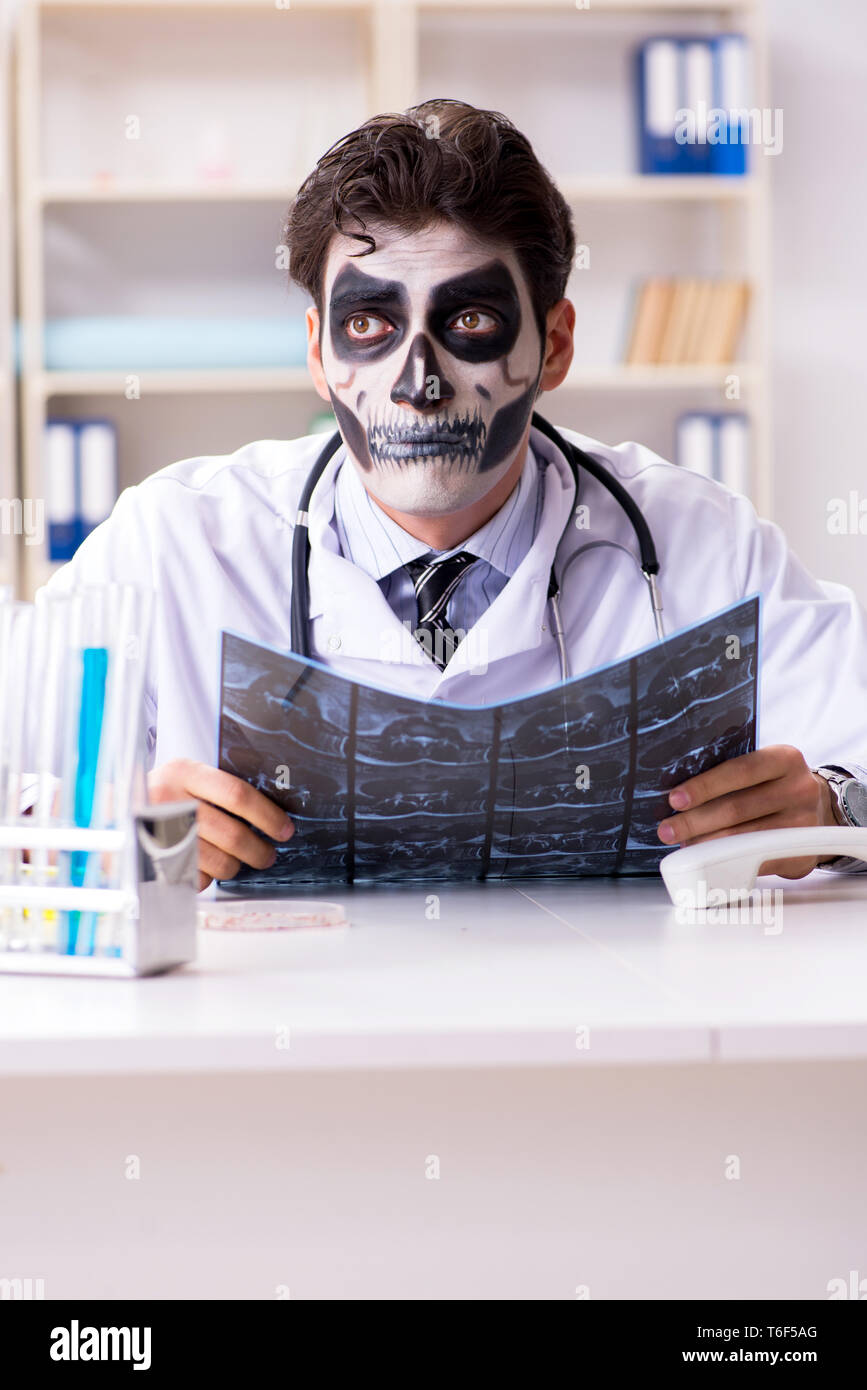 Scary monster doctor working in lab Stock Photo - Alamy