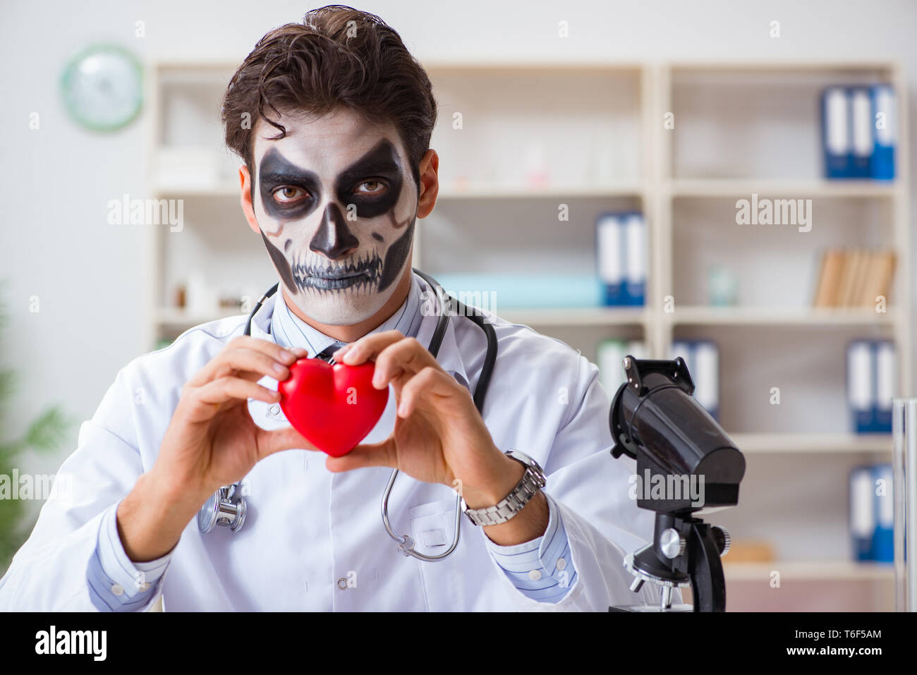 Scary monster doctor working in lab Stock Photo - Alamy