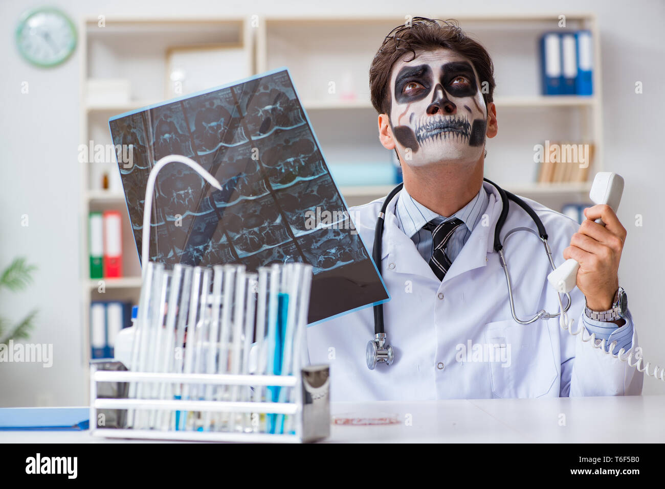 Scary monster doctor working in lab Stock Photo - Alamy