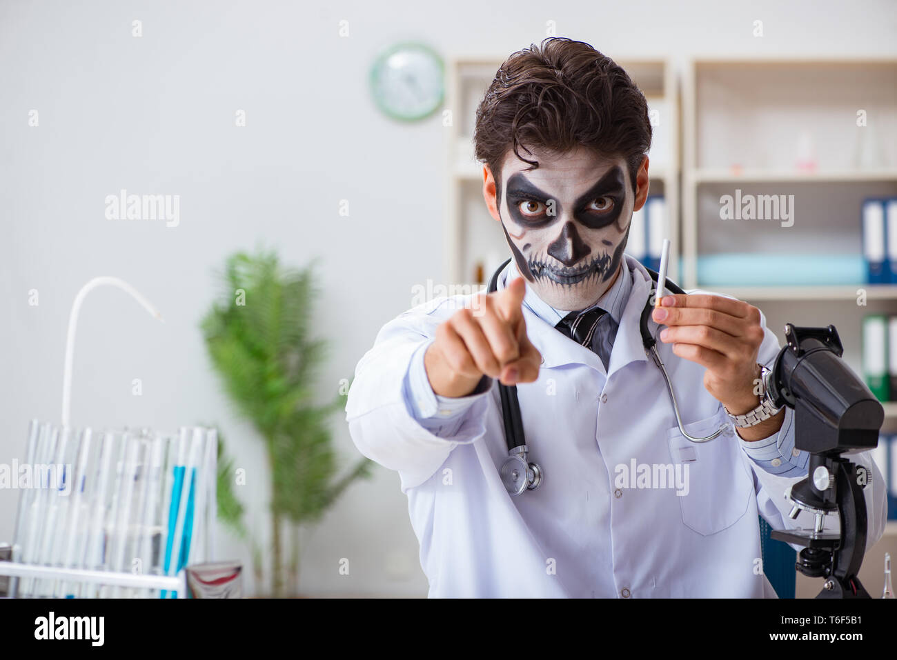 Scary monster doctor working in lab Stock Photo - Alamy
