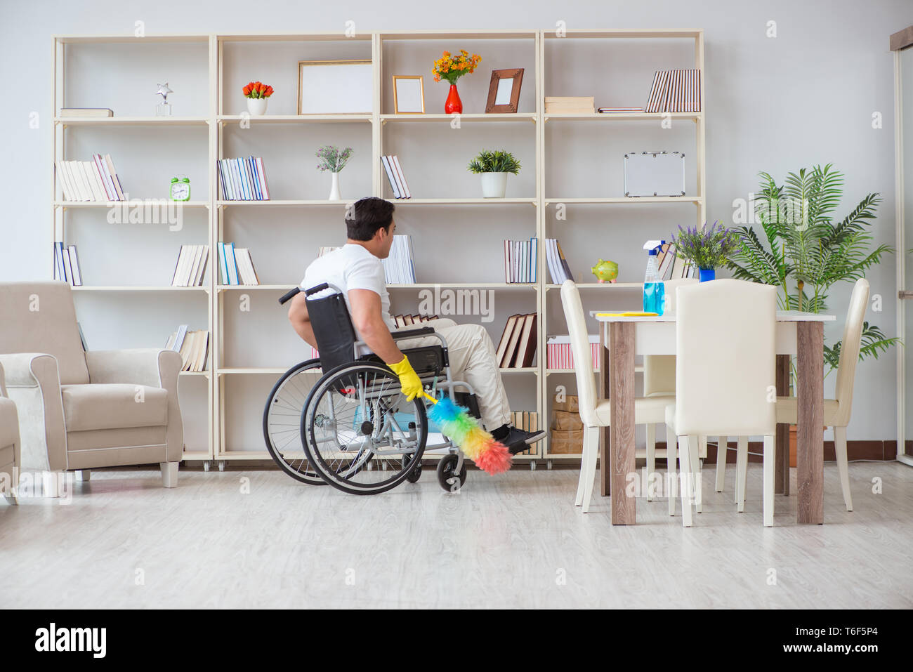 Disabled cleaner doing chores at home Stock Photo - Alamy
