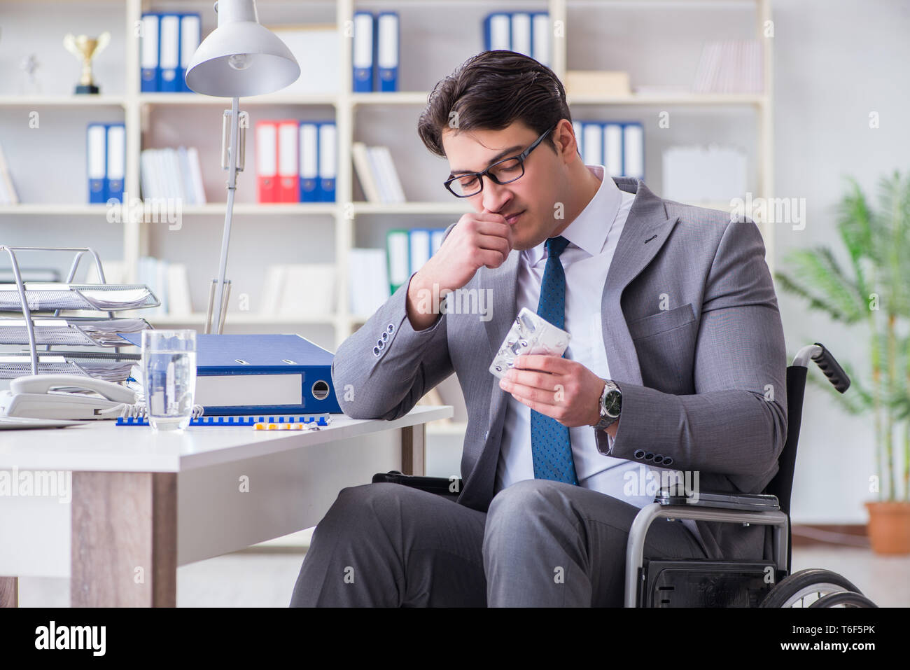 Disabled businessman working in the office Stock Photo - Alamy