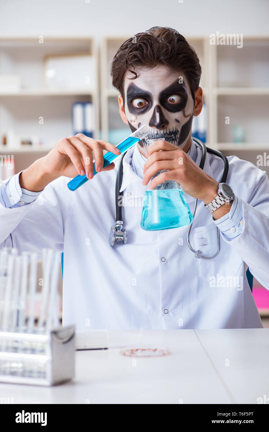 Scary monster doctor working in lab Stock Photo - Alamy