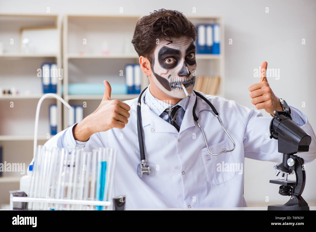 Scary monster doctor working in lab Stock Photo - Alamy