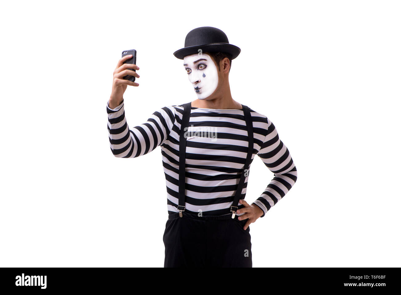 Mime with smartphone isolated on white background Stock Photo - Alamy