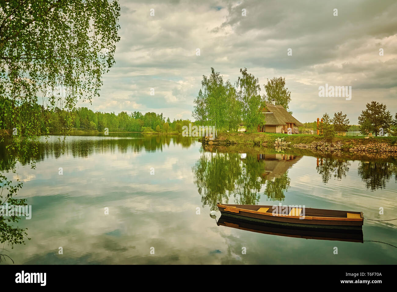 Small wooden boat tree hi-res stock photography and images - Alamy