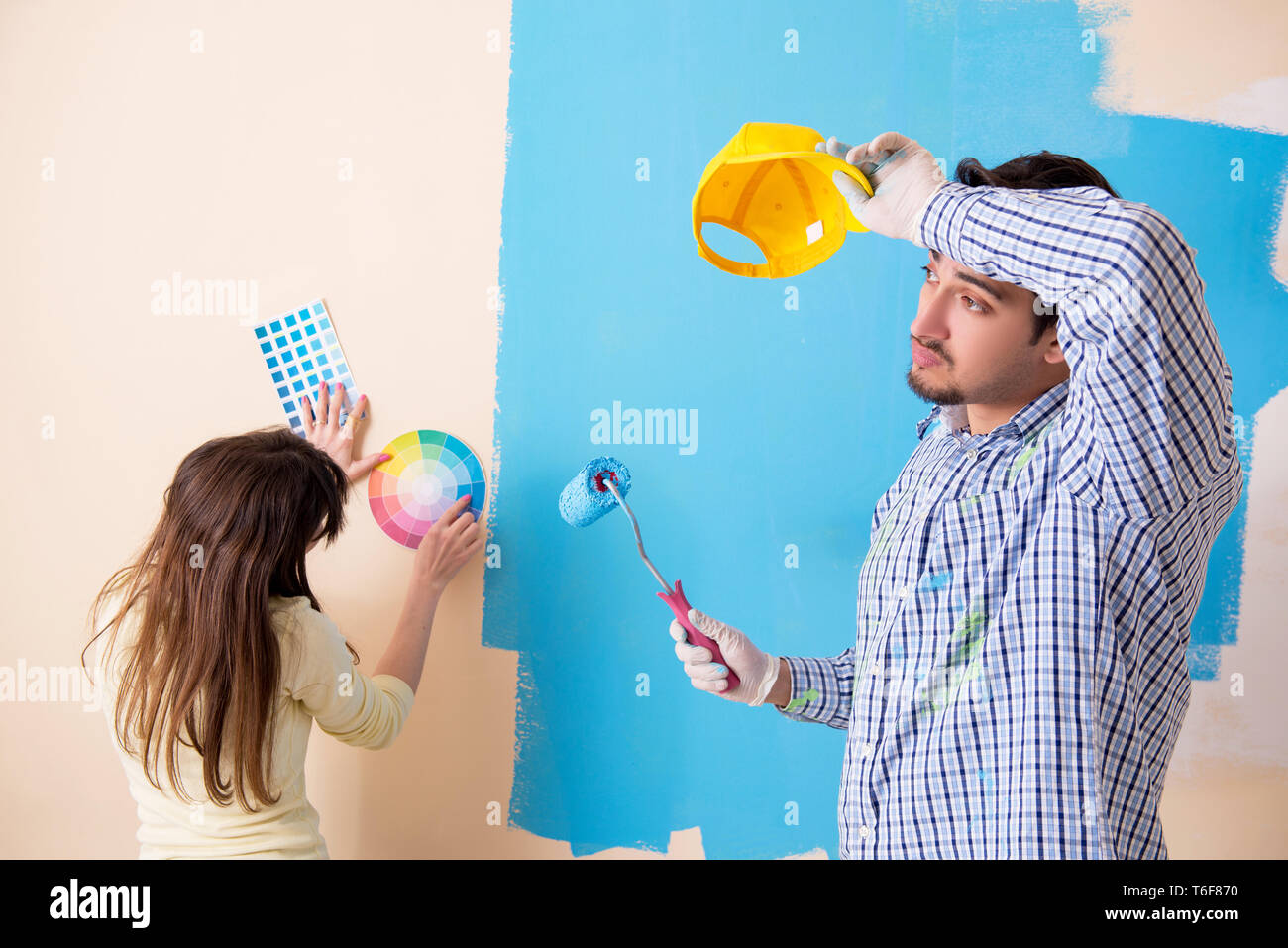 Husband and wife doing renovation at home Stock Photo - Alamy