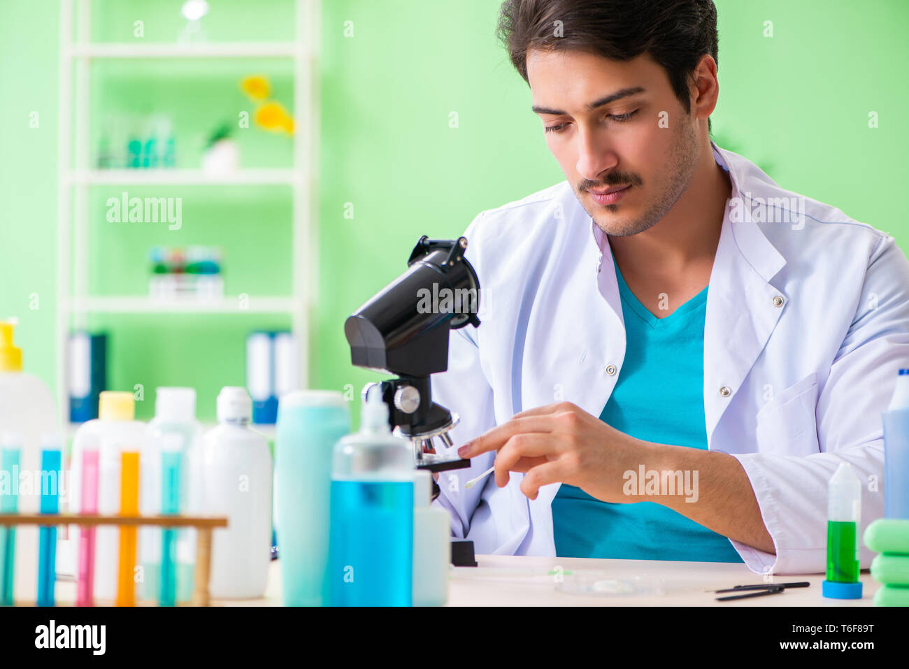 Chemist testing soap in the lab Stock Photo - Alamy