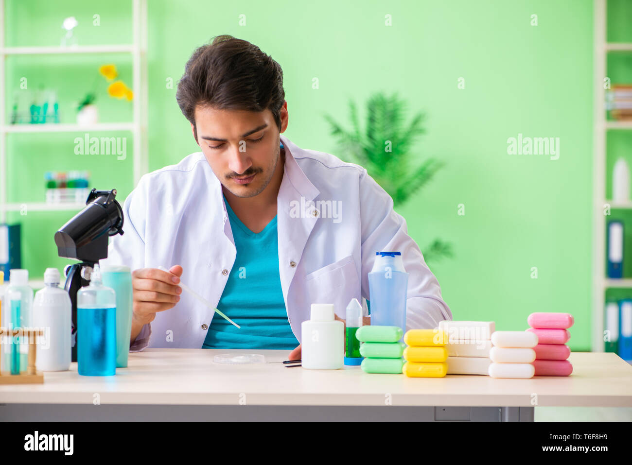 Chemist testing soap in the lab Stock Photo - Alamy