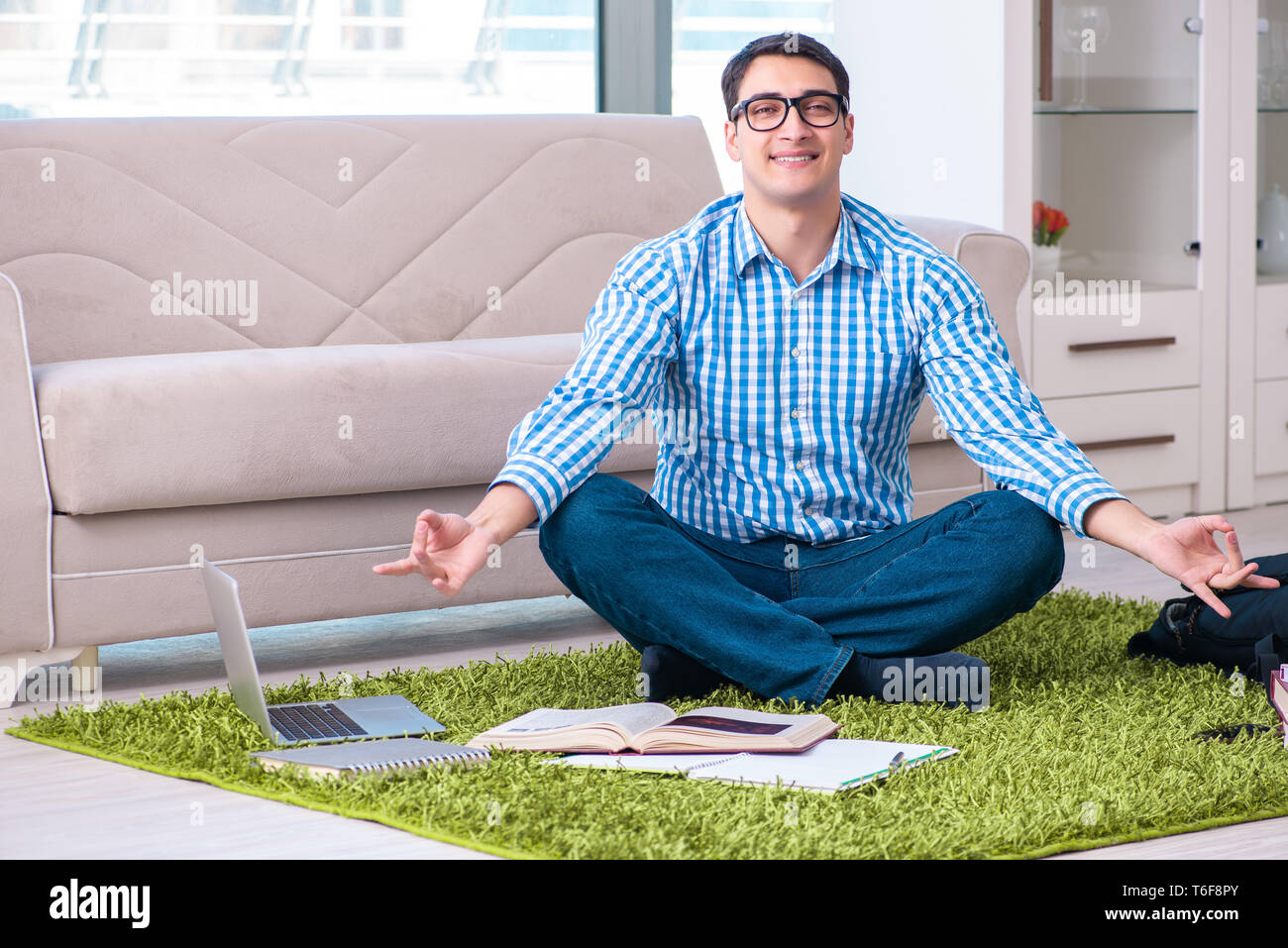 Student meditating and preparing for university exams Stock Photo - Alamy