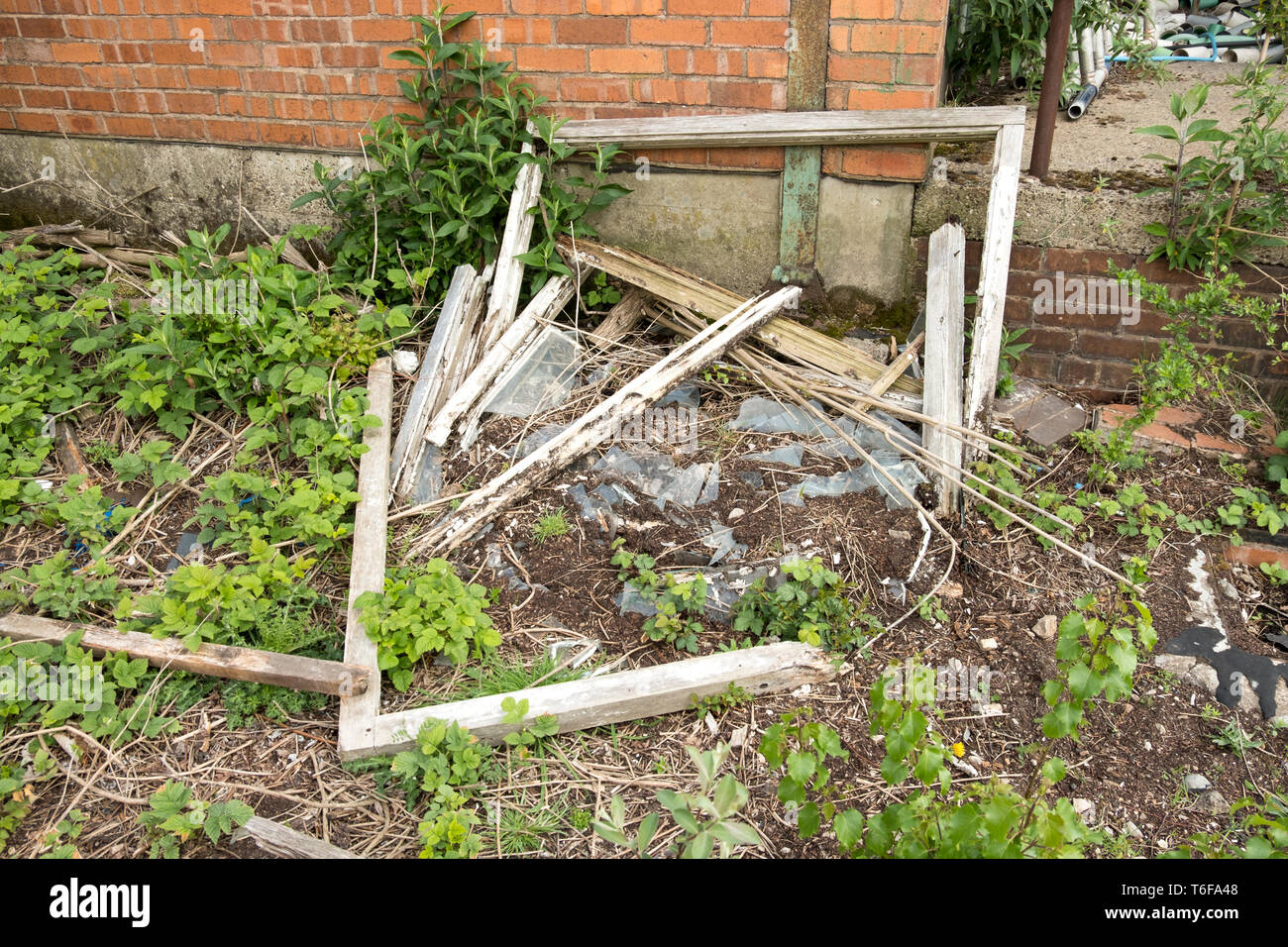 Old broken discarded window frame Stock Photo - Alamy