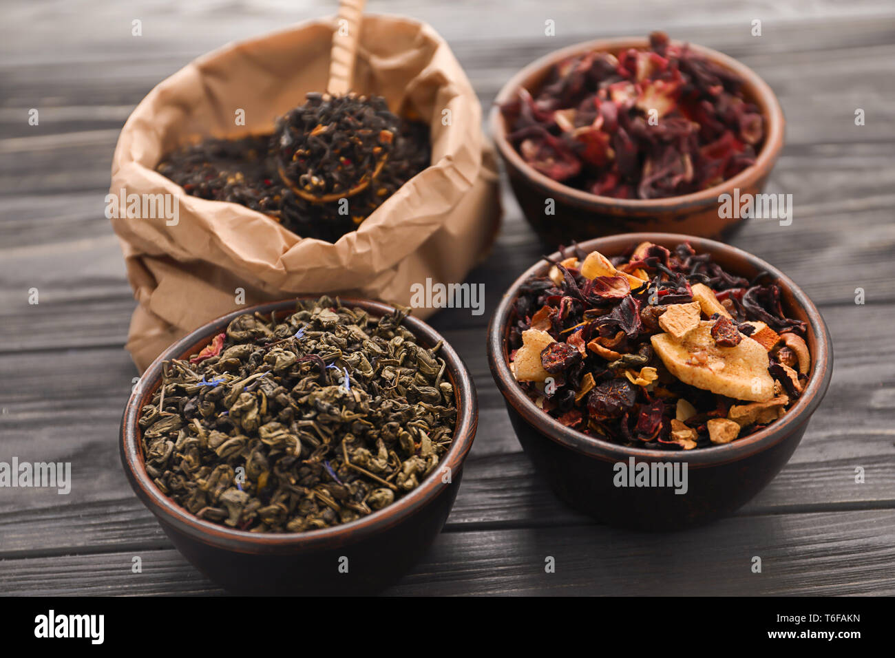 Different types of dry tea leaves on table Stock Photo - Alamy