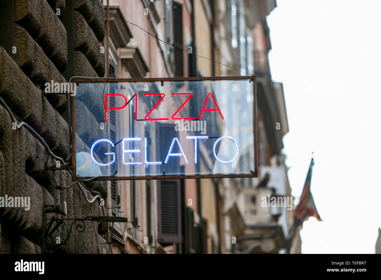 Italian bar signboard outside closeup with text reading Pizza Gelato ...