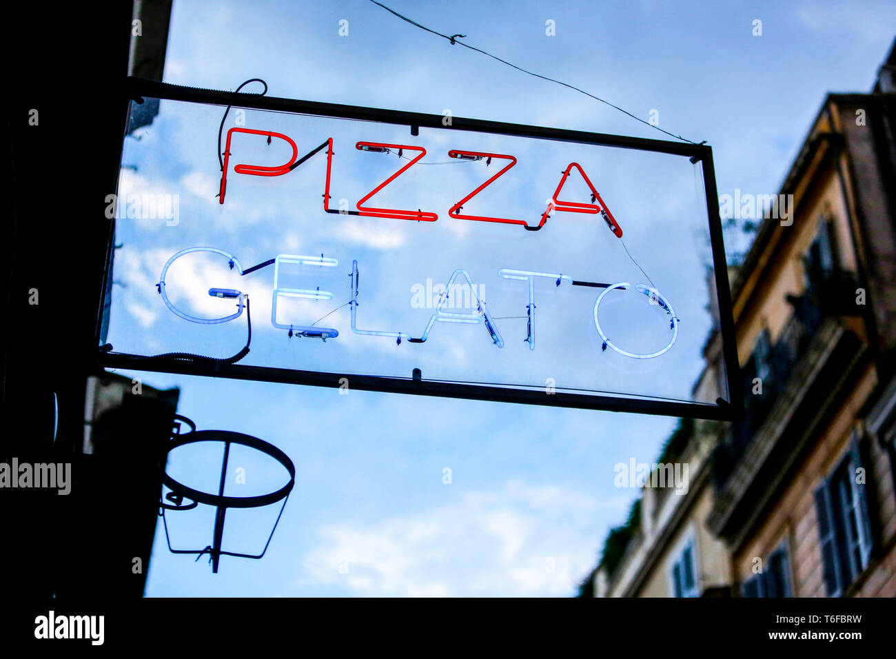 Italian snack bar signboard outside closeup with text reading Pizza ...