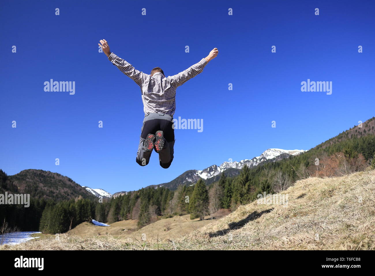 Man jumping joy mountain hi-res stock photography and images - Alamy