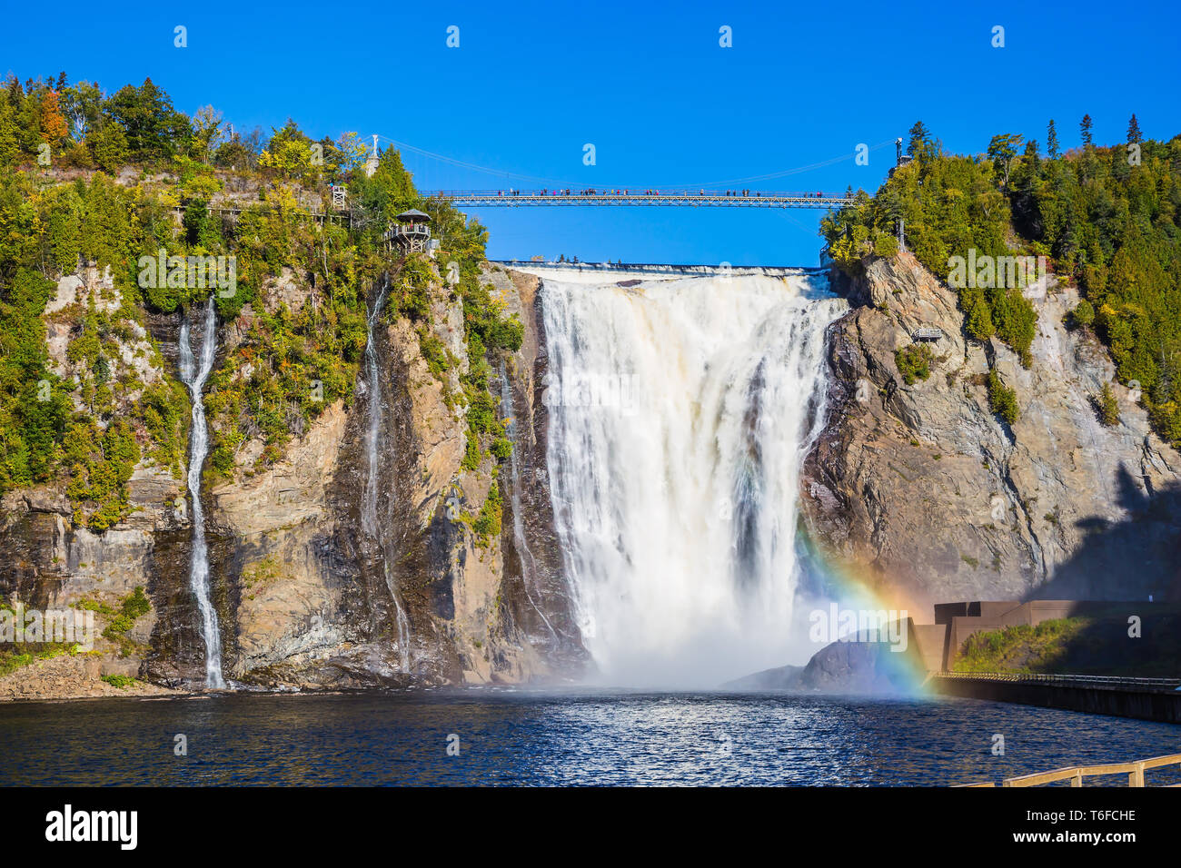 The magnificent rainbow plays in falls Stock Photo - Alamy