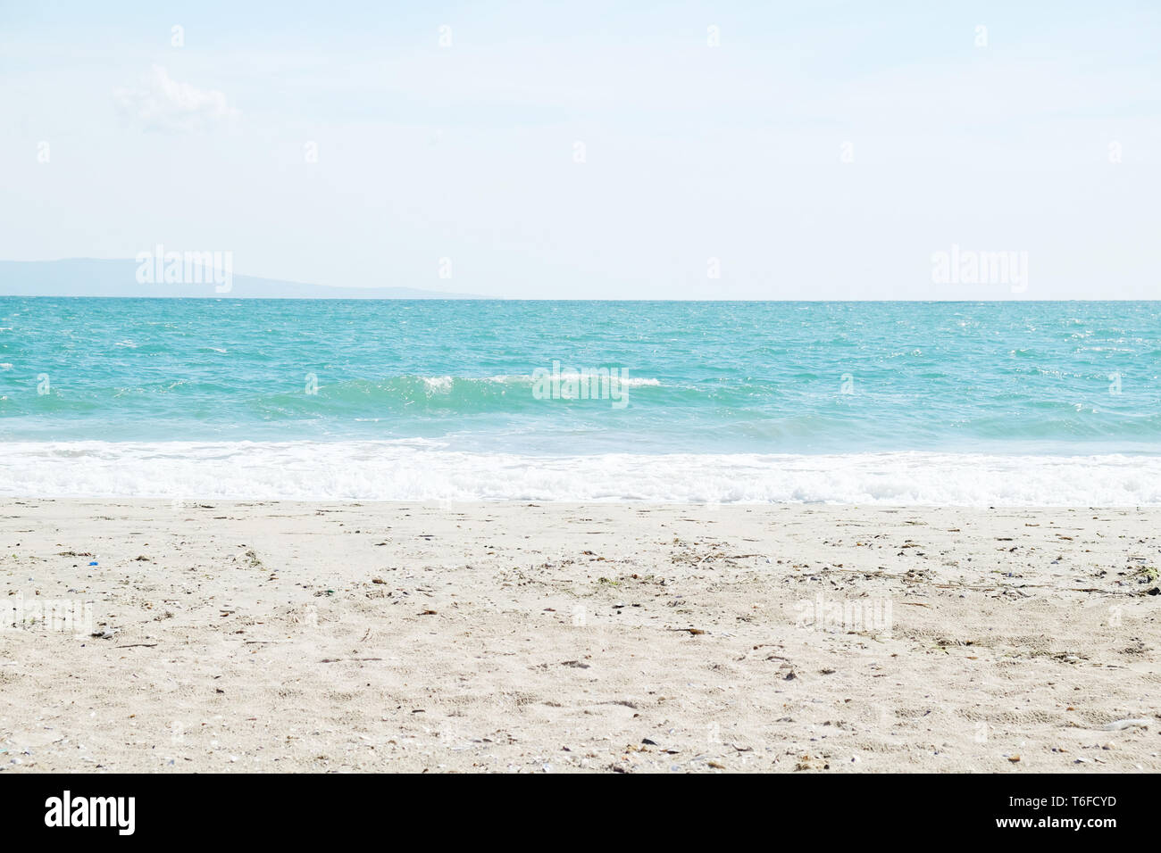Beach and sea in bright sunlight Stock Photo - Alamy