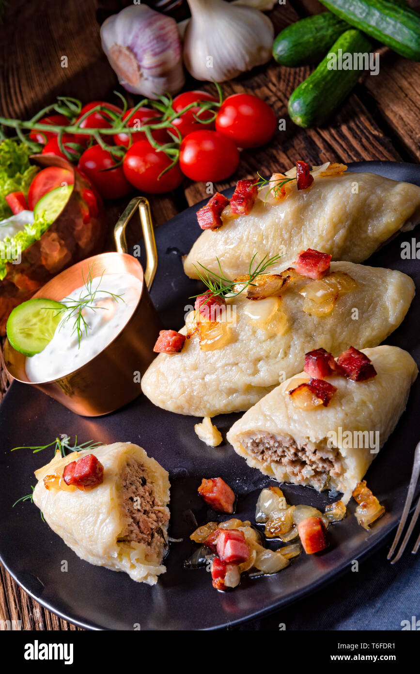 Rustic Cepelinai, a specialty Lithuanian and Polish cuisine Stock Photo ...