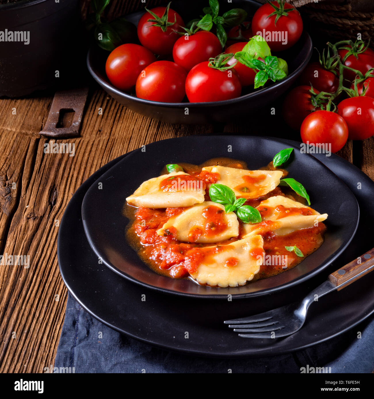 rustic Delicious Pasta - Ravioli in tomato sauce with basil Stock Photo ...