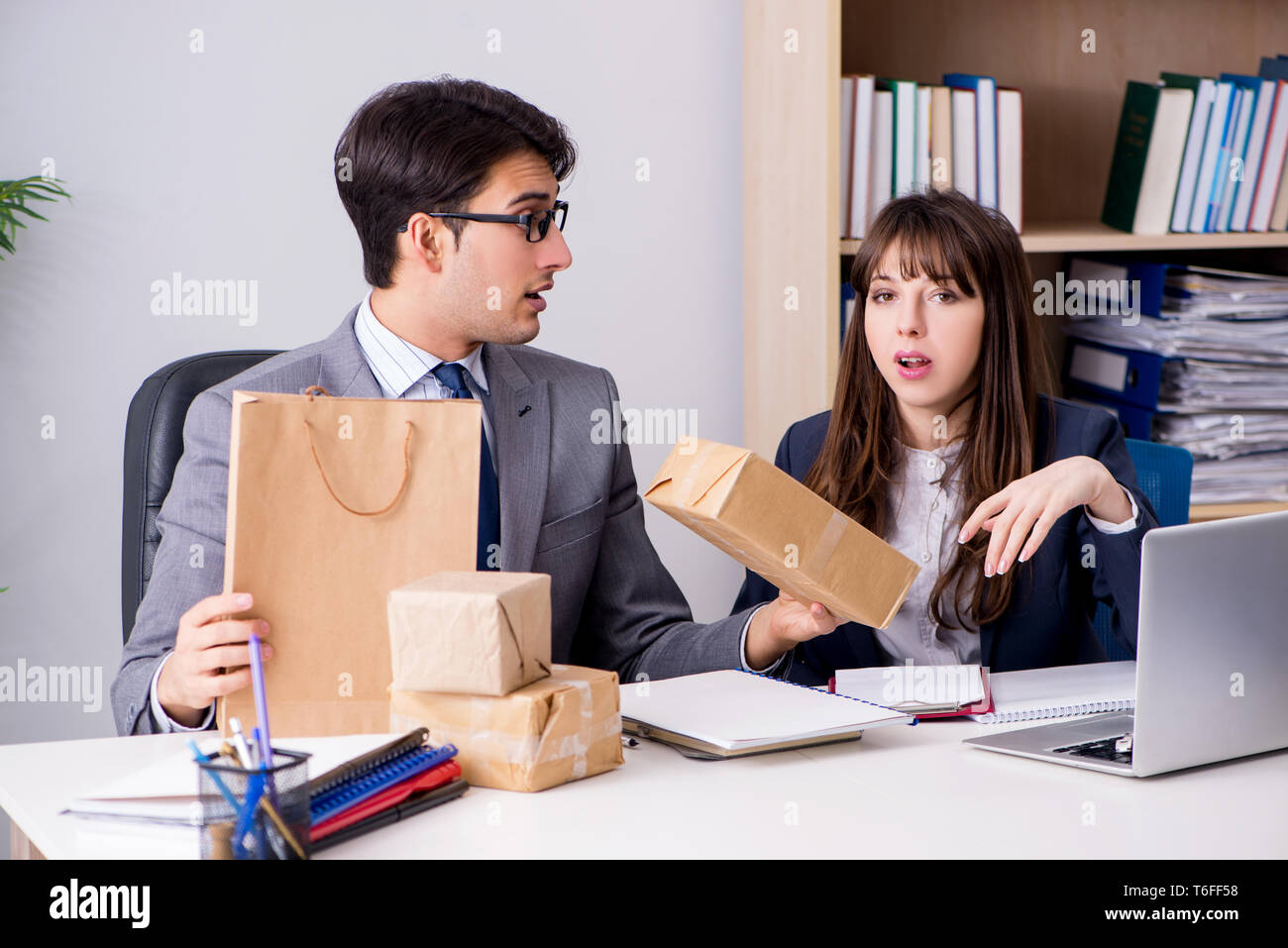 Business people receiving new mail and parcels Stock Photo - Alamy