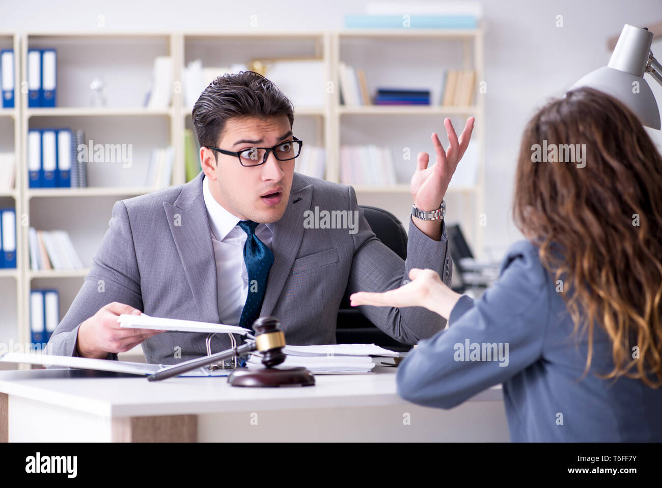 Lawyer discussing legal case with client Stock Photo - Alamy