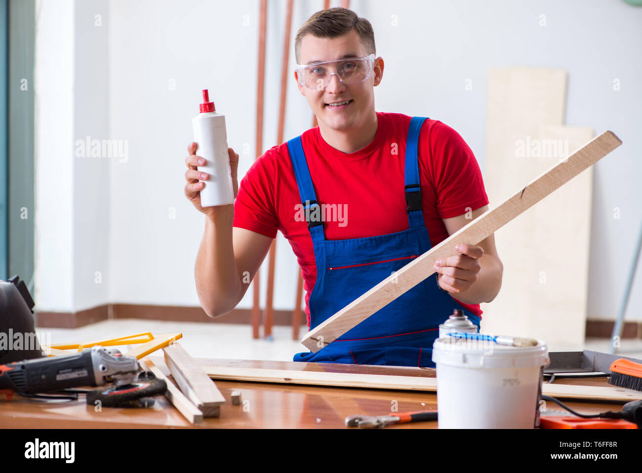 Contractor working in the workshop Stock Photo - Alamy