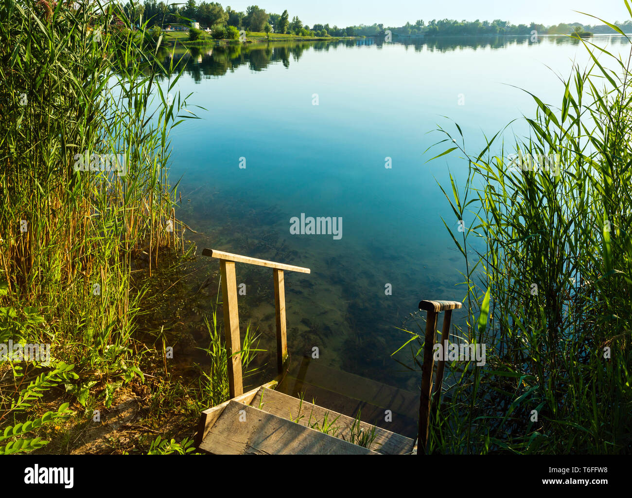 Wooden stairs to summer lake Stock Photo - Alamy